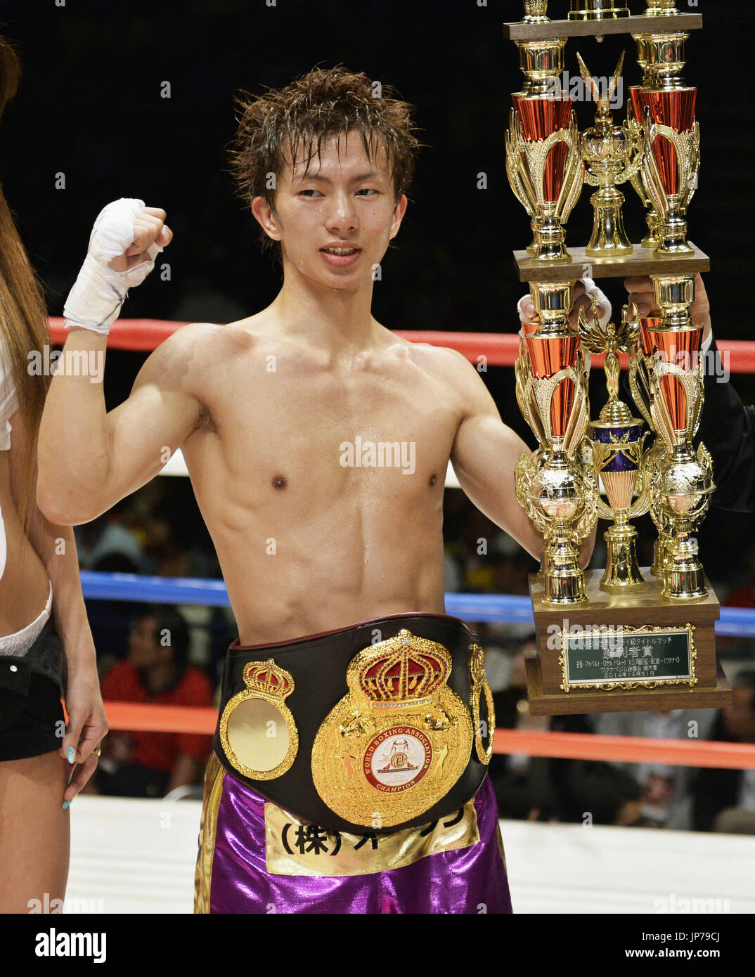 Japan's WBA light flyweight champion Ryoichi Taguchi thrusts his fist ...