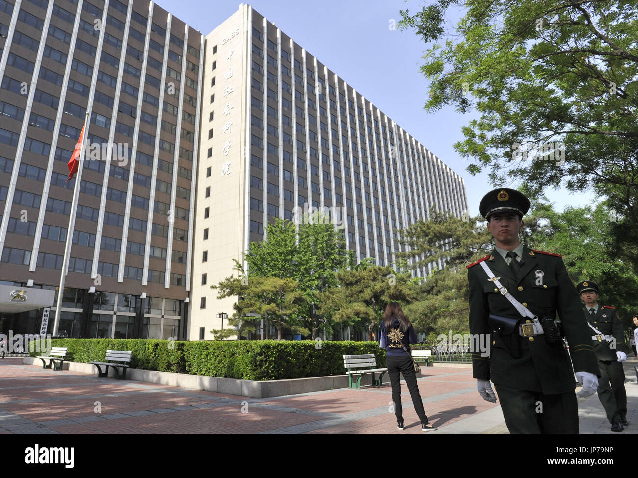 Members of the Chinese People's Armed Police Force patrol outside the ...