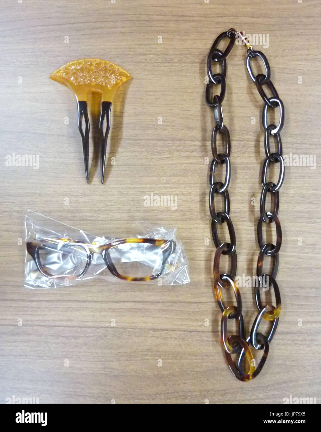 Three pieces of "Edo Bekko" tortoiseshell craftwork are shown at the ...