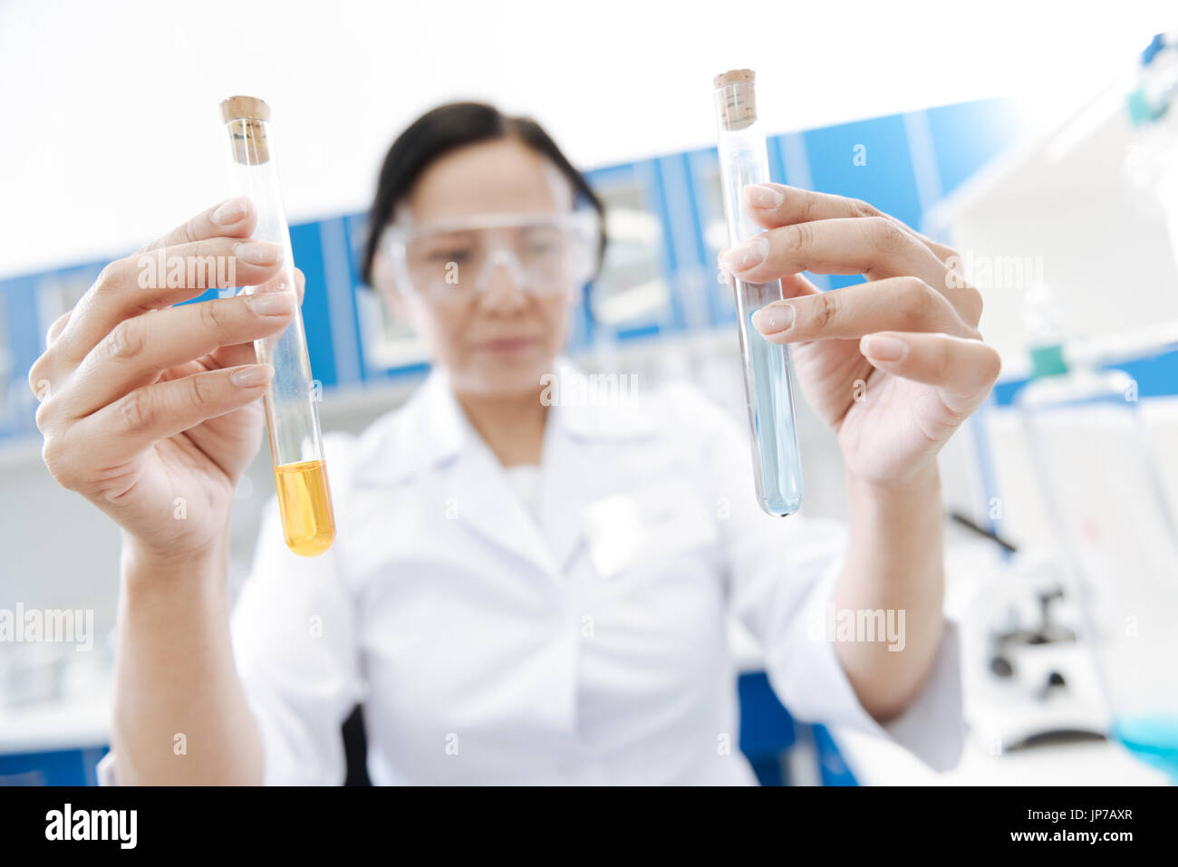Test tubes being filled with chemical reagents Stock Photo - Alamy