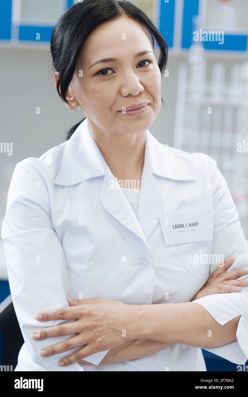 Delighted positive woman standing in the lab Stock Photo - Alamy
