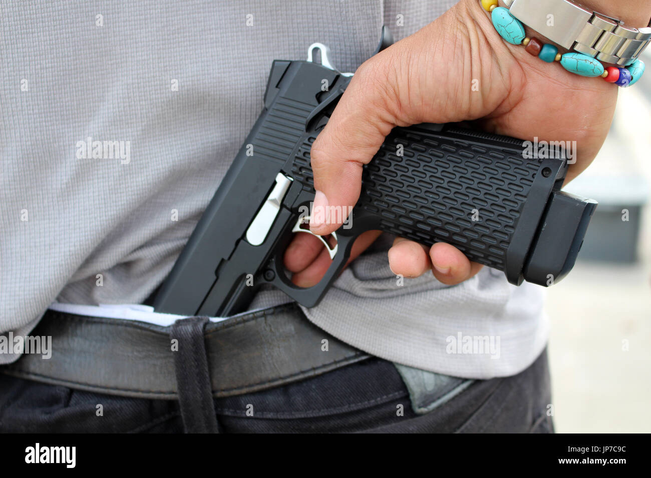 Back view man gun hi-res stock photography and images - Alamy