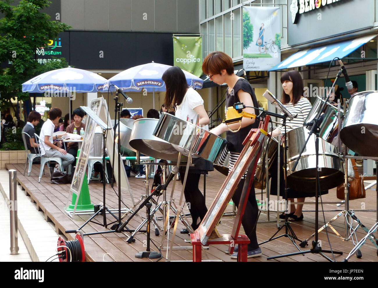 A steel-pan band performs on an outdoor stage on May 20, 2015, along a ...