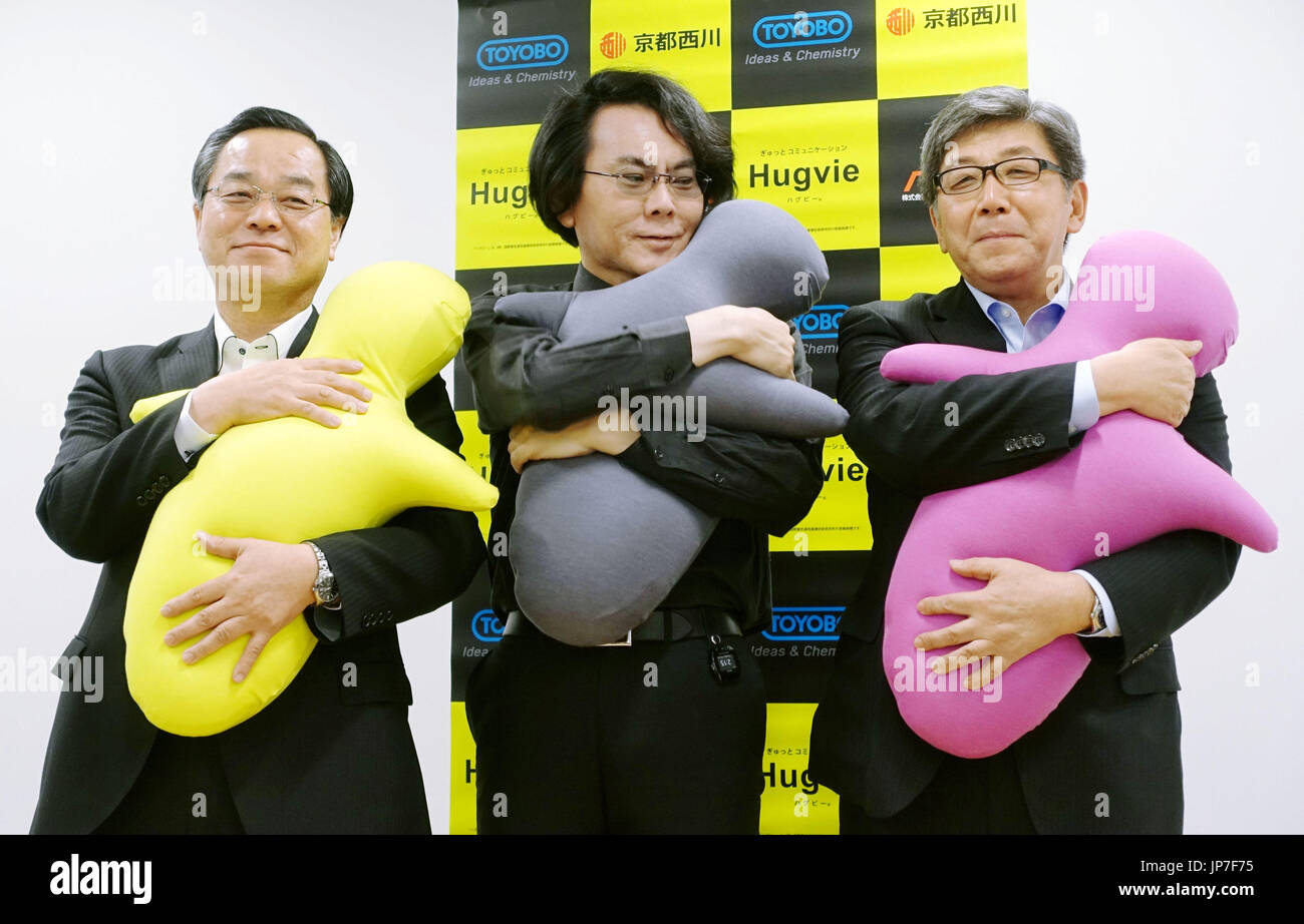 Hiroshi Ishiguro (C), an ATR fellow and professor of robotics at Osaka ...
