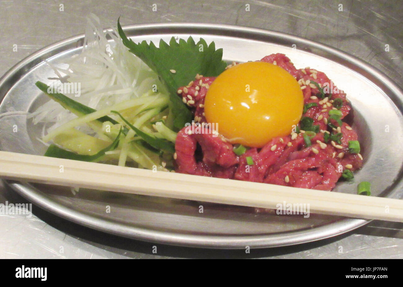 Game meat restaurant "Wana" (trap) in Tokyo serves a plate of sliced ...