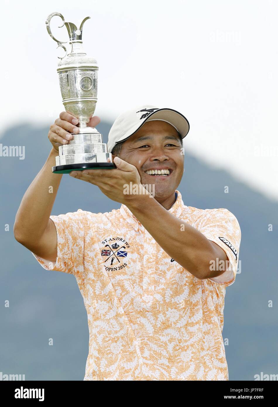 Japanese golfer Taichi Teshima shows off the trophy after winning the ...