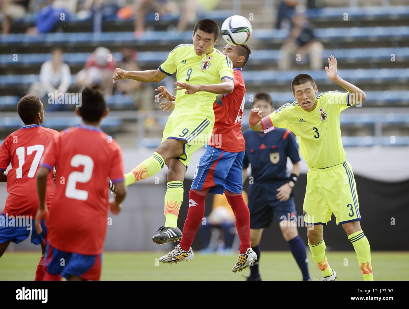Forward Takumi Kato (C) and defender Daiki Hashioka (far R) of the ...
