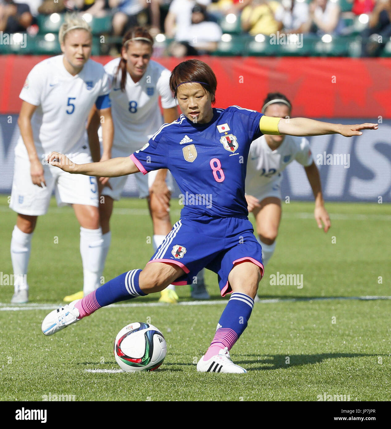 Japan's midfielder Aya Miyama (8) scores the opener with a penalty kick ...