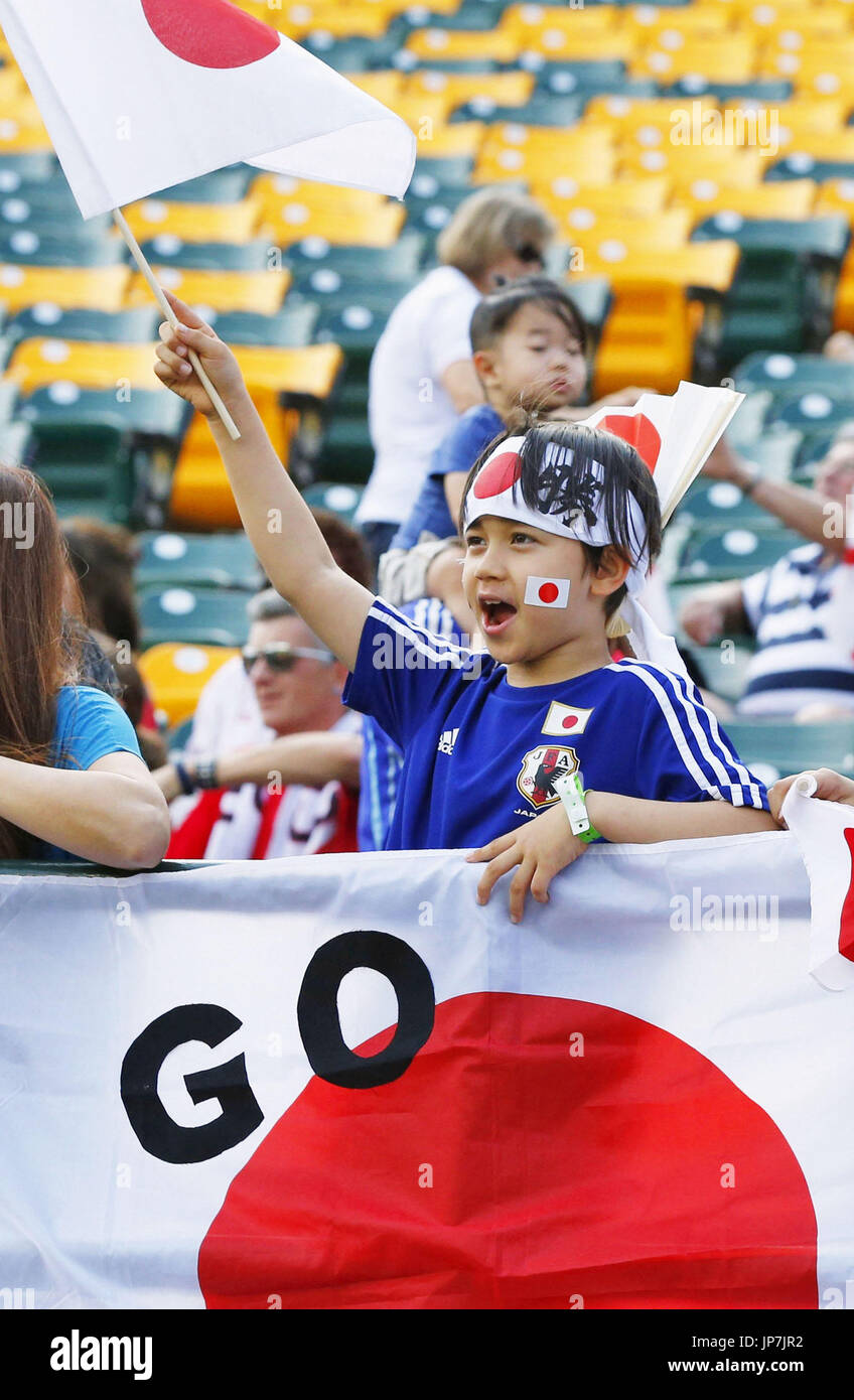 Supporters cheer for Nadeshiko Japan, who competed with England during ...