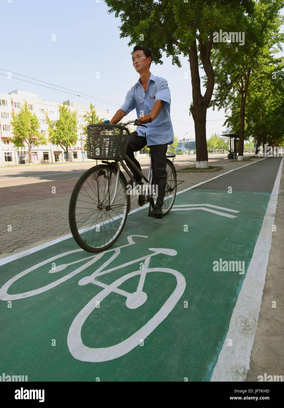 A North Korean man cycles on a road set aside for bicycles in Pyongyang ...