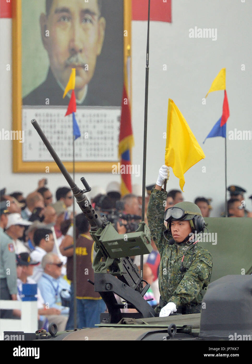 A Taiwanese soldier passes in front of spectators during a military ...