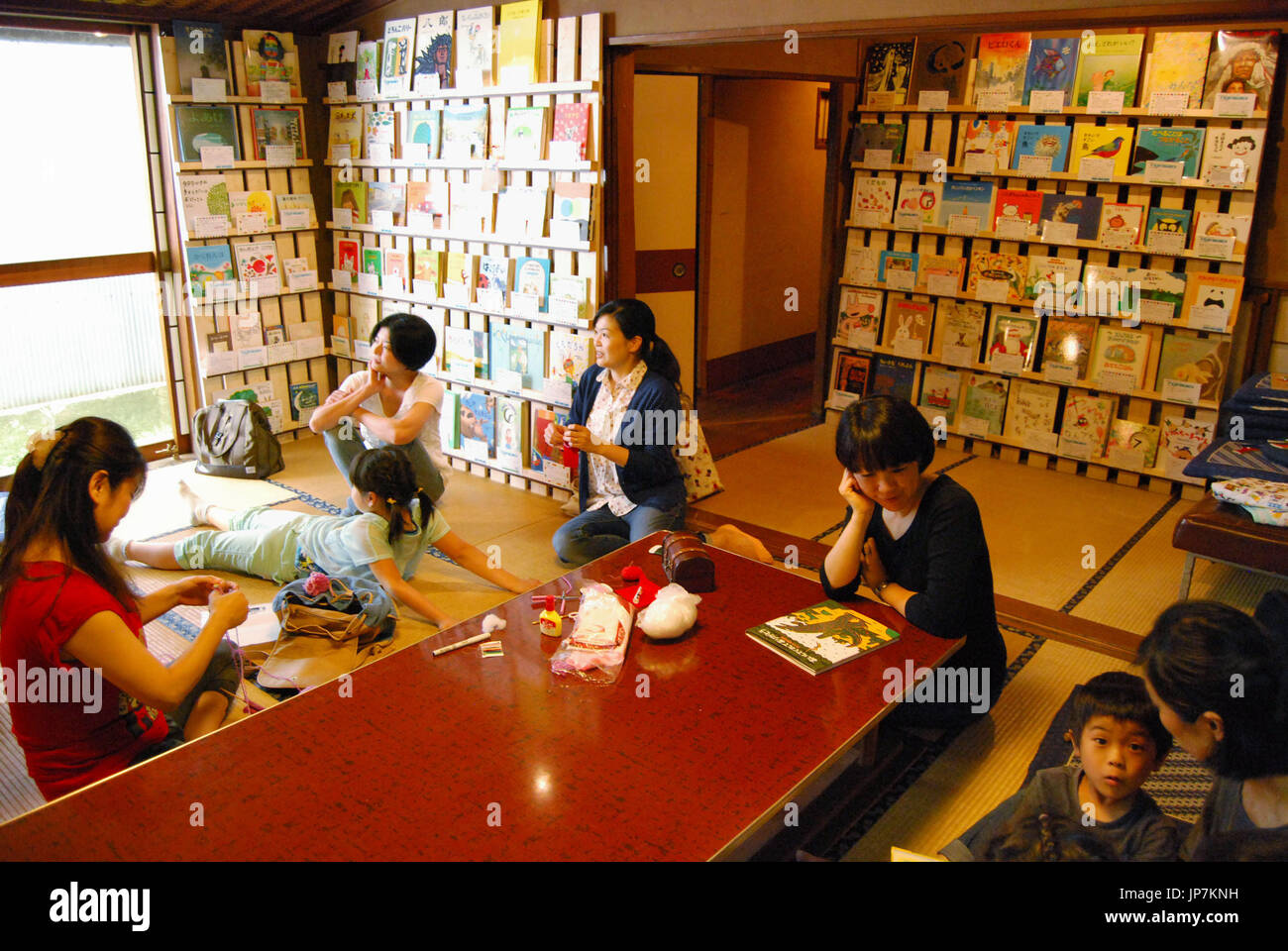 Young mothers spend time at Hanamichi Toshokan, a picture book library ...