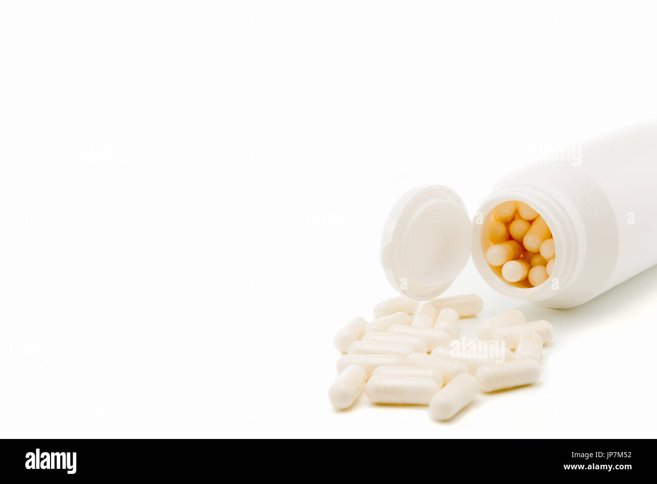 Bottle white medicine capsules isolated on white background ...