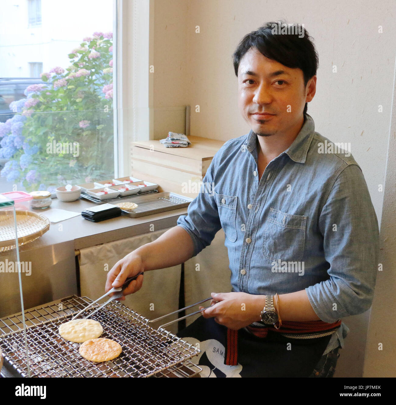 Masahiro Sanpei, representative of Samurai Senbei, a "senbei" rice ...