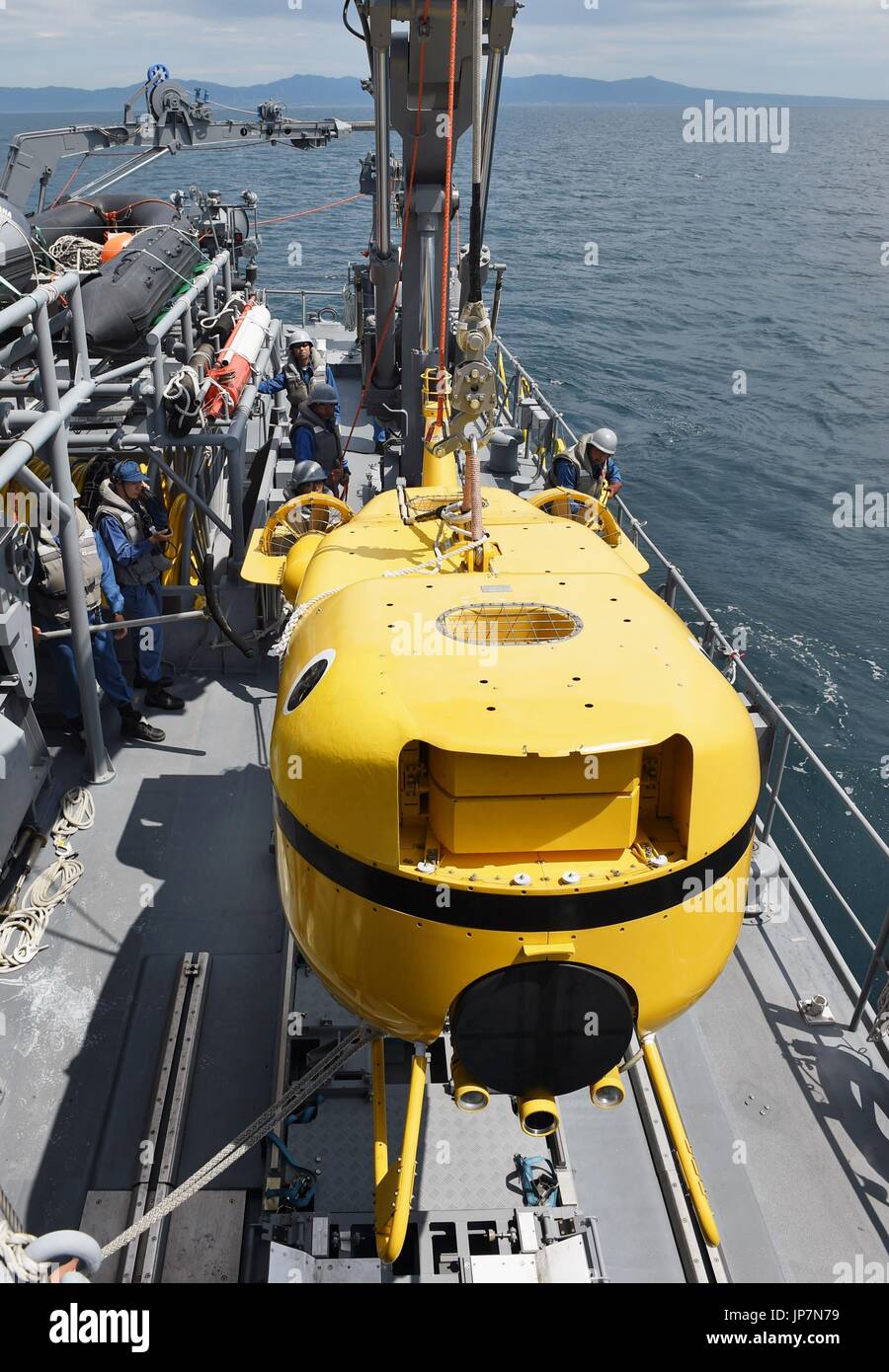 A remote-controlled robot is suspended in the air during a minesweeping ...