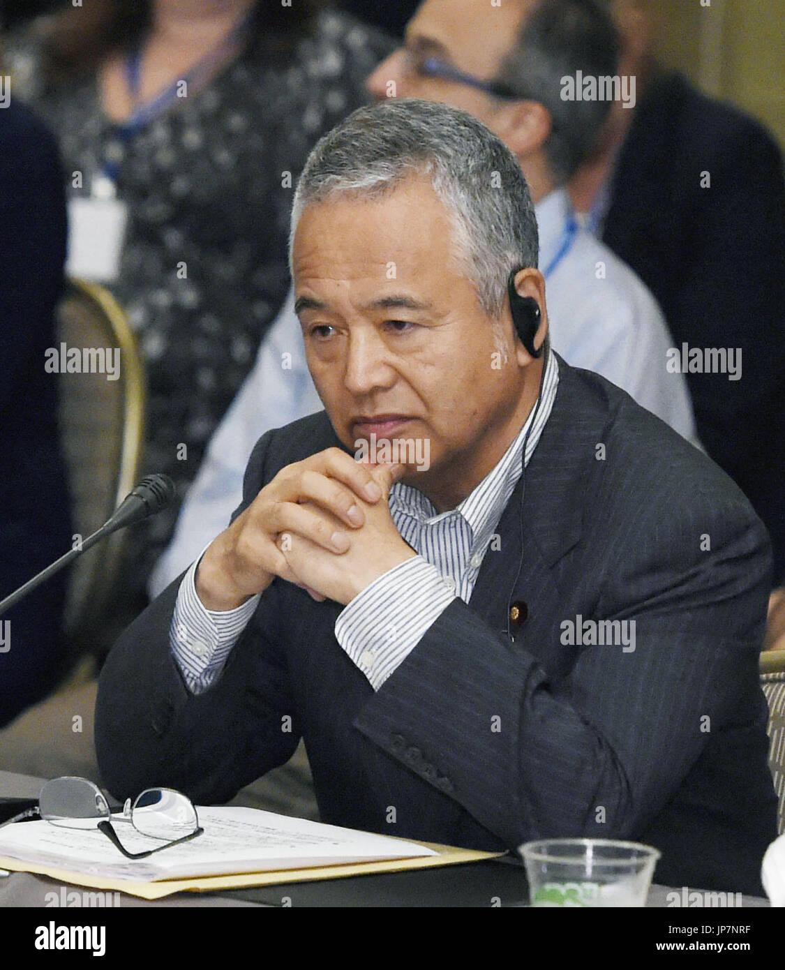Japanese Economic and Fiscal Policy Minister Akira Amari attends a ...