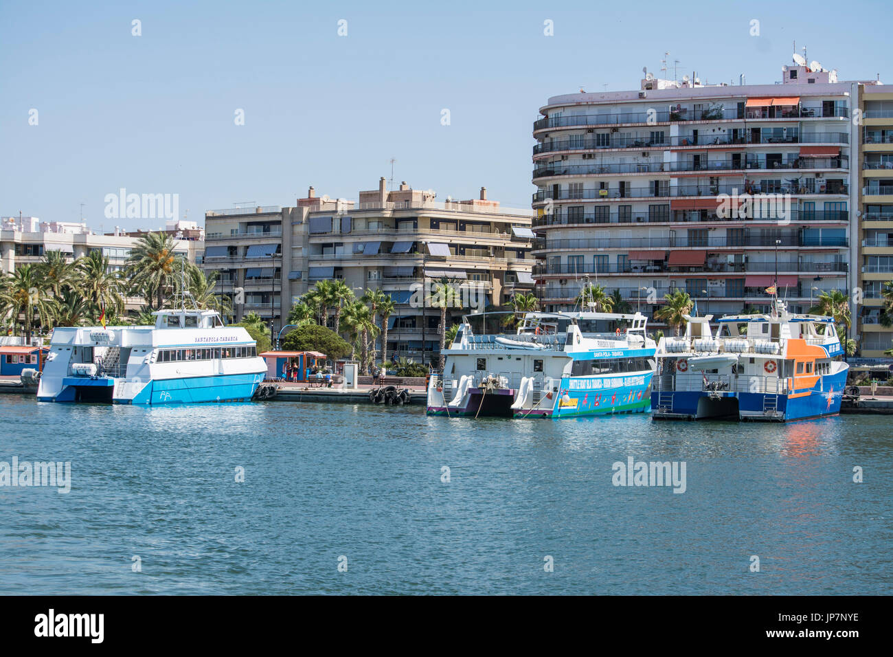 Tourist boats for the island of Tabarca moared in the harbour of Santa ...