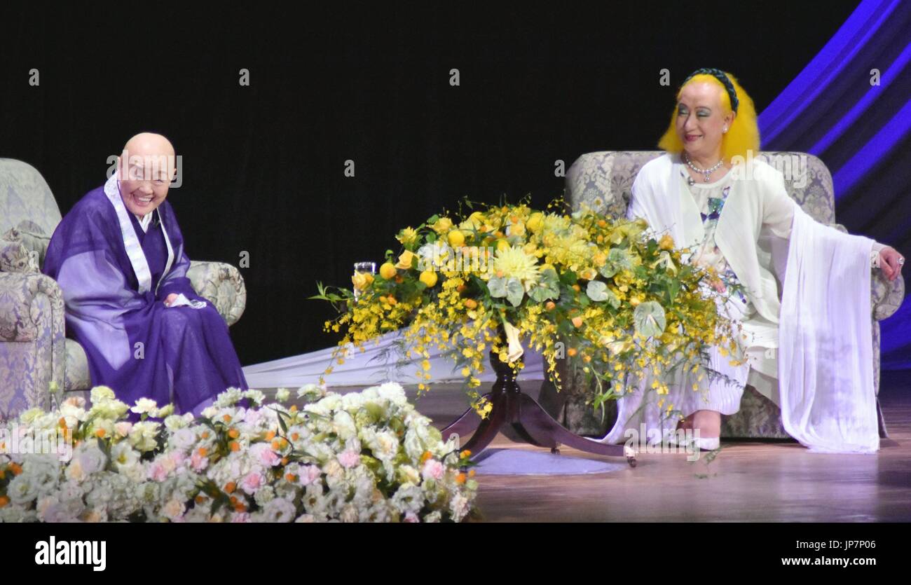 Writer Jakucho Setouchi (L) and Singer Akihiro Miwa talk at a gathering ...