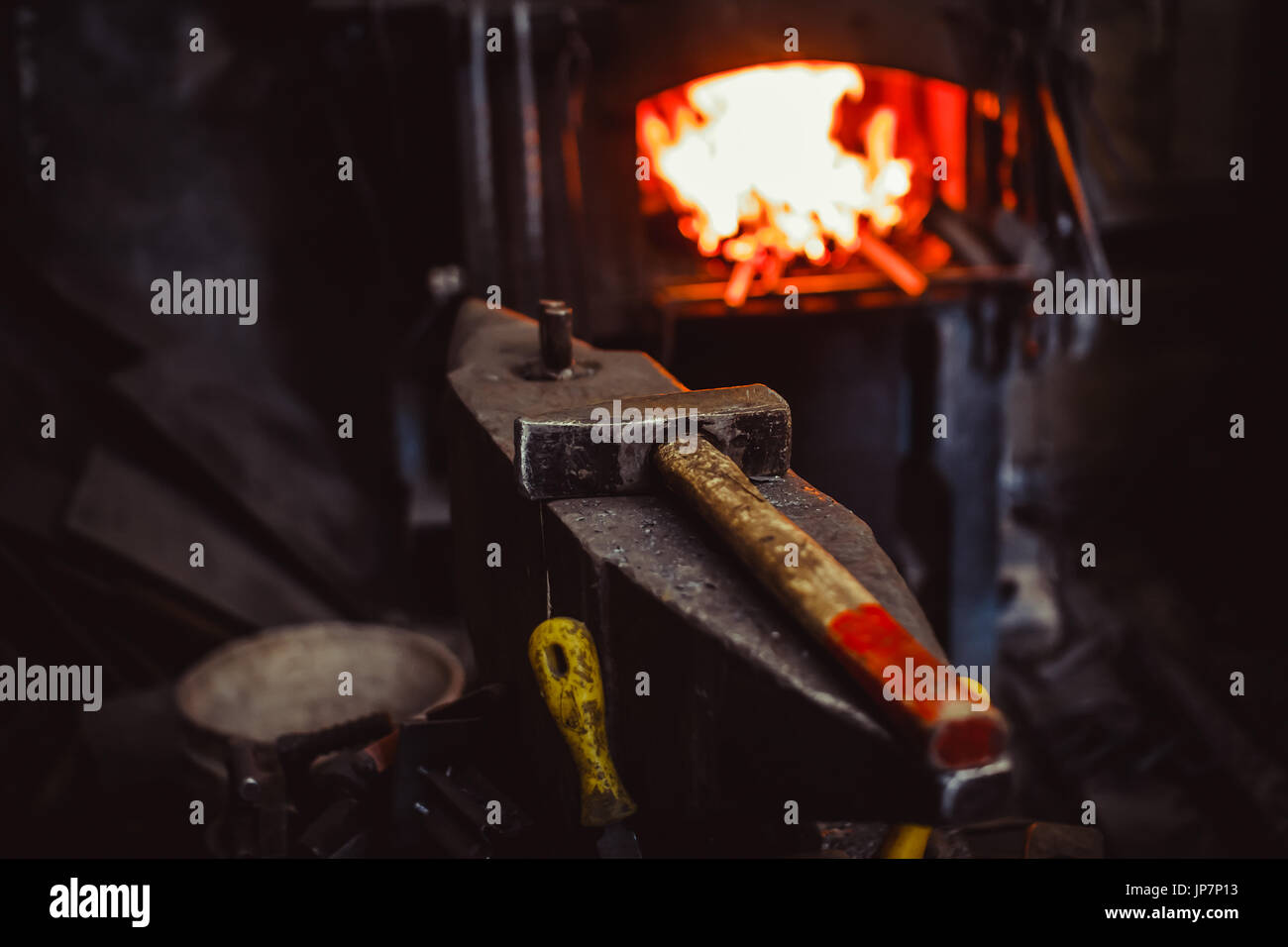 Tools - hammer and anvil used by a blacksmith in old shop Stock Photo ...