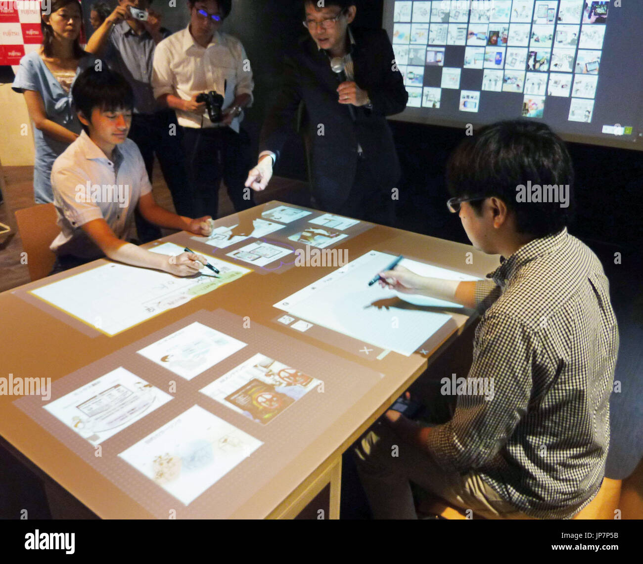 Fujitsu Ltd. shows the press in Tokyo on July 27, 2015, a computer ...