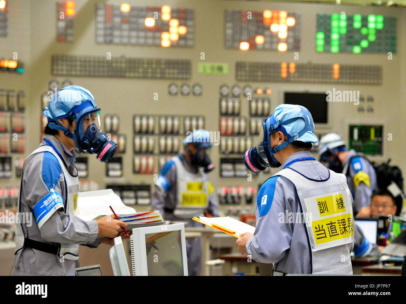 An anti-disaster drill is conducted in the central control room of ...
