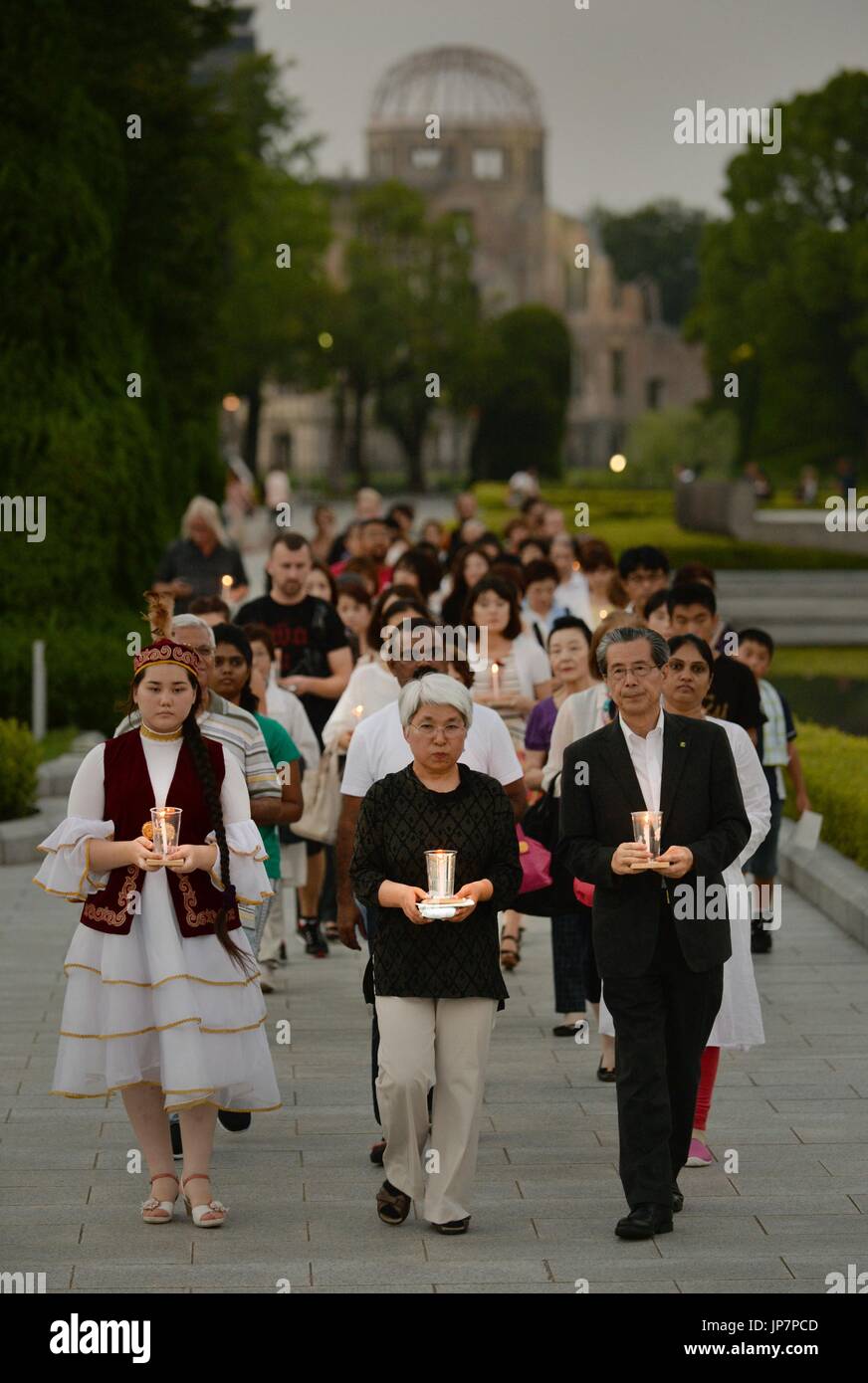 Around 130 people walk around the cenotaph for atomic bomb victims in ...