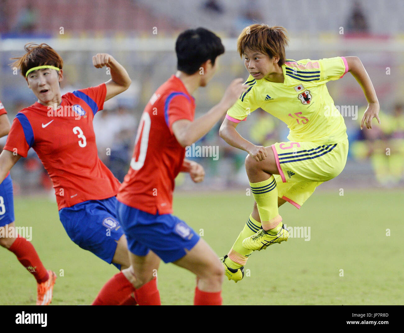 Nina Tanaka of Japan (R) shoots during the first half of a game against ...