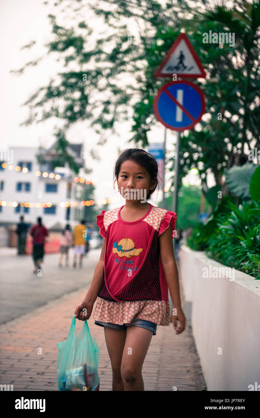 LUANG PRABANG, LAOS - MARCH 12, 2017: Vertical picture of Lao girl ...
