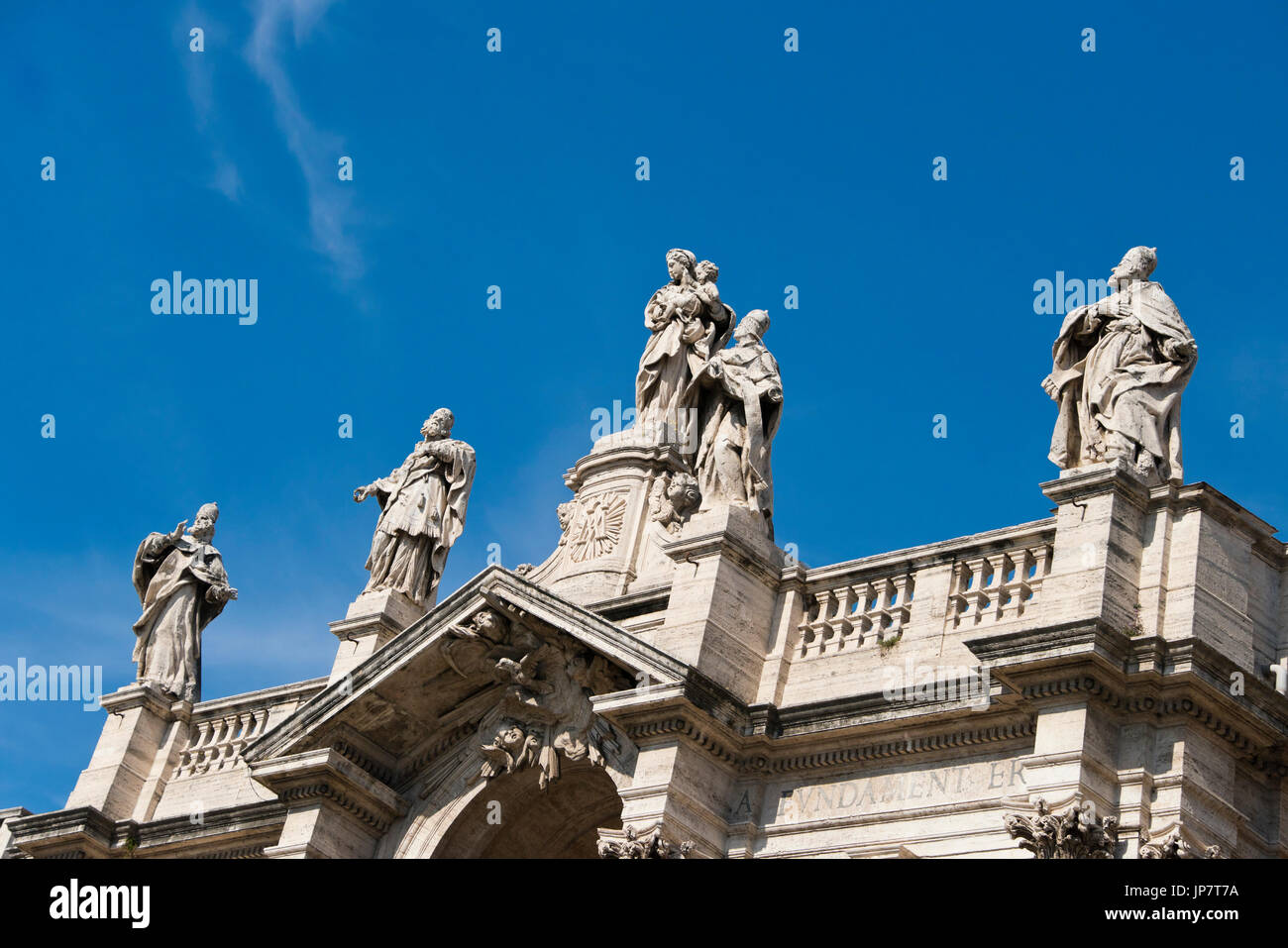 Horizontal close up view of the statues adorning the roof of Basilica ...