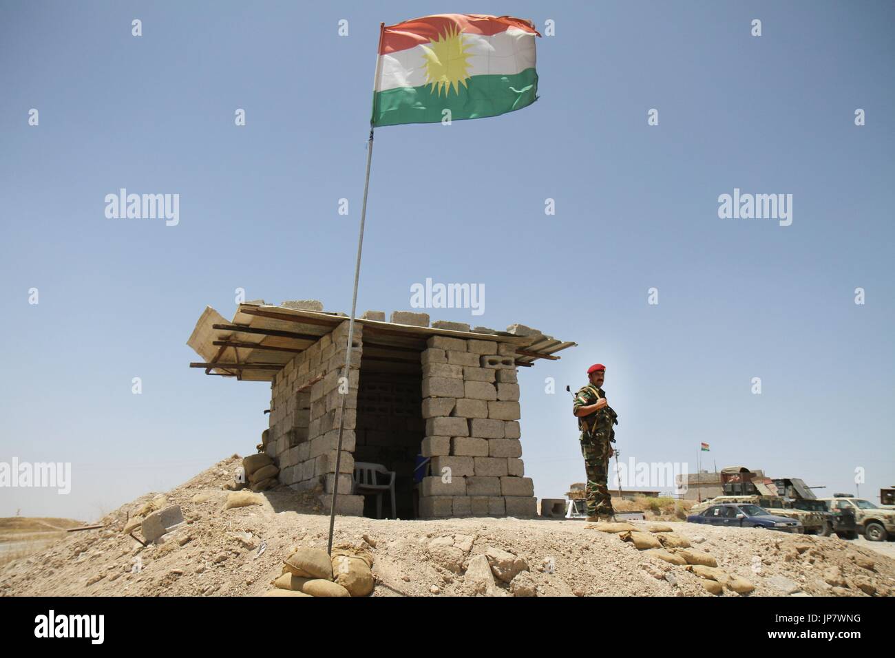 The flag of Iraq's autonomous Kurdistan Regional Government flutters on ...