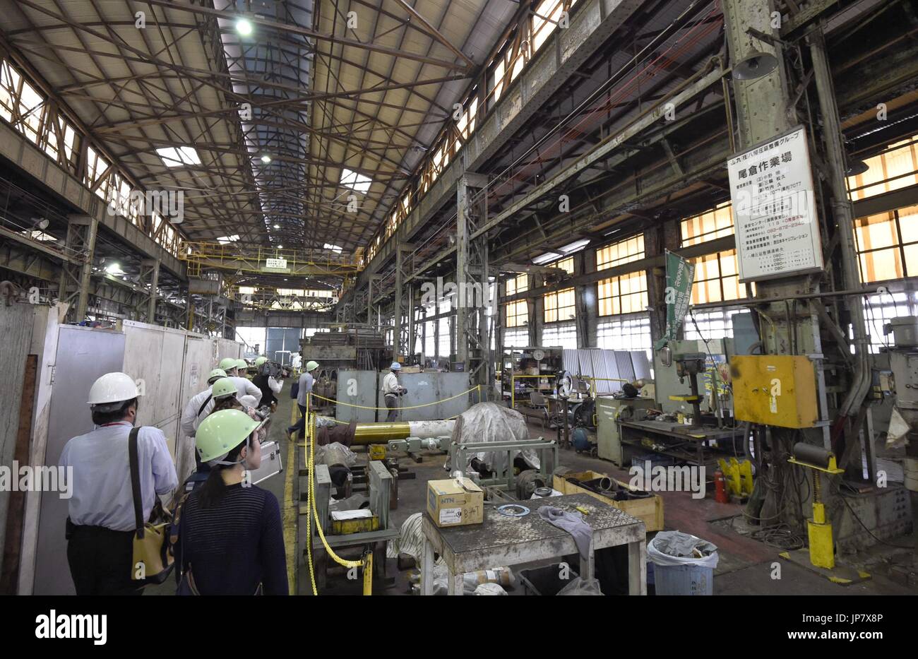 Photo taken on June 15, 2015, shows work under way at a repair factory ...