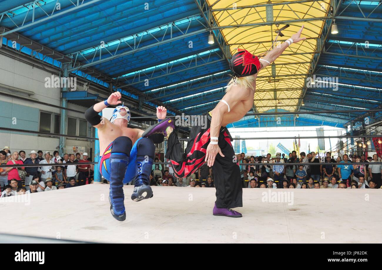 Wrestlers fight in an inaugural bout of the Kaisen pro wrestling group ...