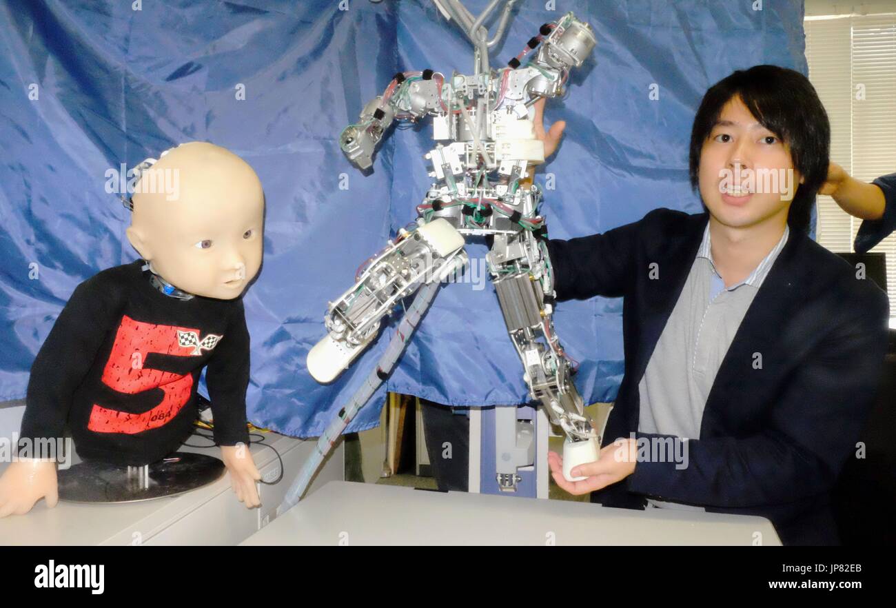 Hisashi Ishihara, a robotics researcher at Osaka University, shows the ...