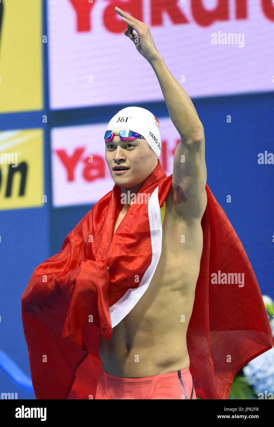 Sun Yang of China acknowledges the crowd after winning the 800-meter ...
