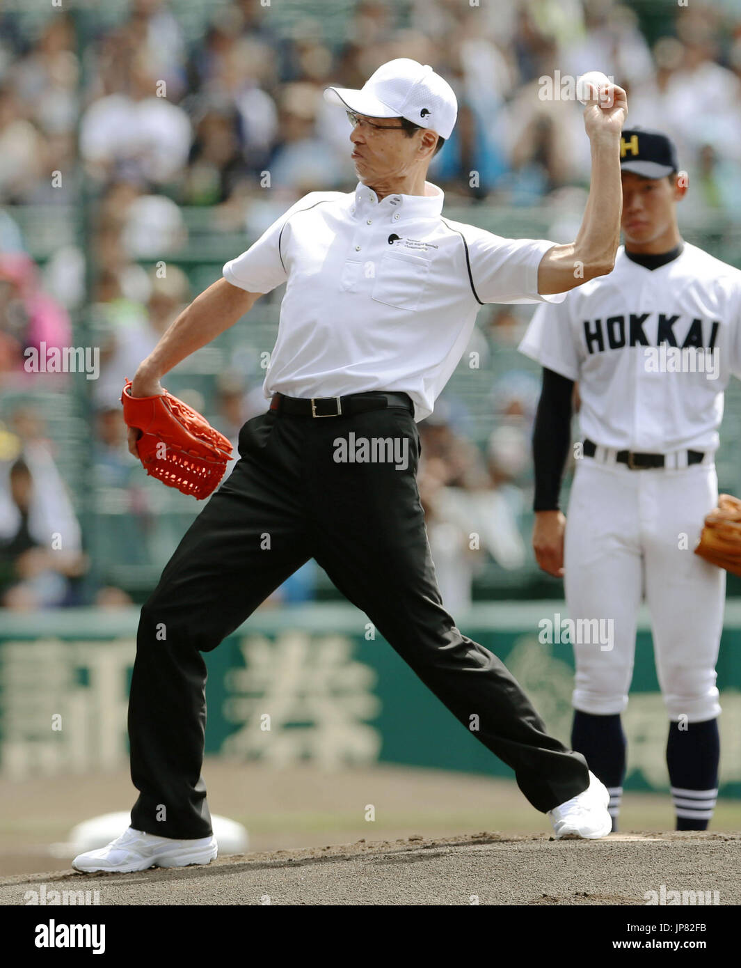 All-time home run king Sadaharu Oh throws the ceremonial first pitch at ...