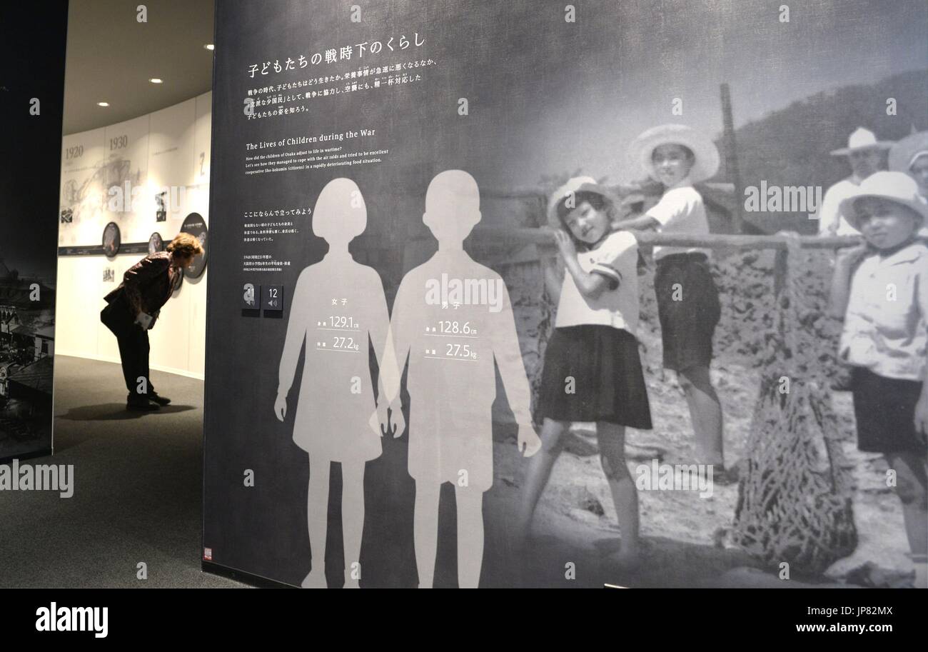 An enlarged photo of Japanese children during World War II is displayed ...