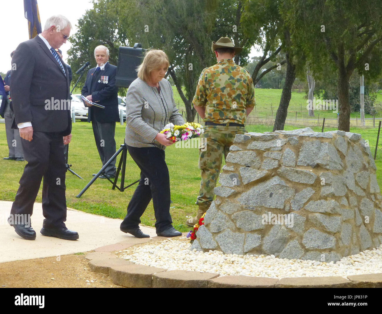 Flowers are offered to commemorate the victims of the 1944 Cowra ...