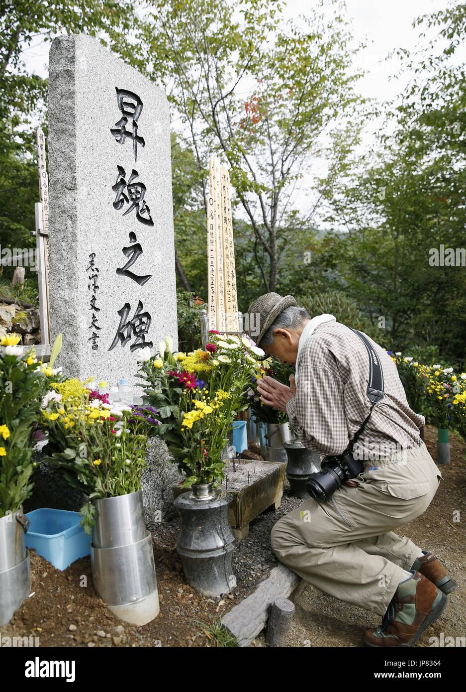 A man offers prayers for the victims of the 1985 Japan Airlines jumbo ...