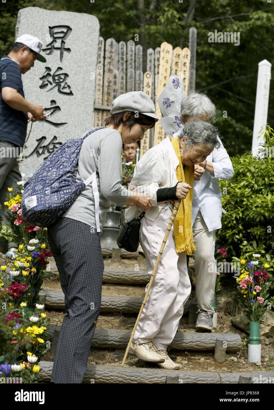 Mourners visit the cenotaph on Osutaka Ridge, the accident site of the ...