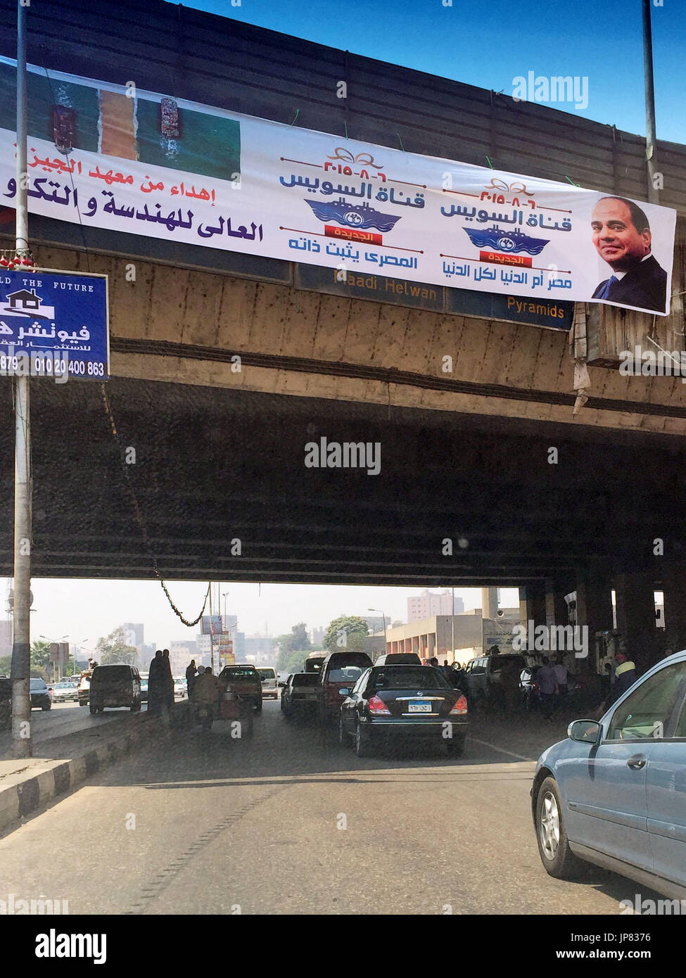 A banner celebrating the opening of a new Suez Canal waterway is ...