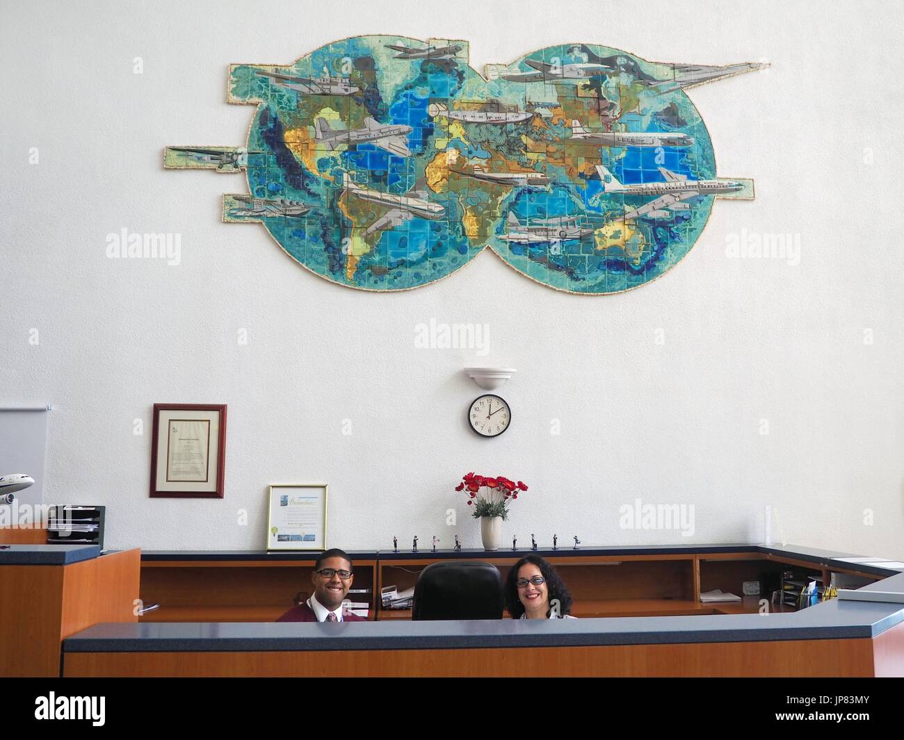 Tile art depicting successive Pan Am planes flying over the world hangs ...