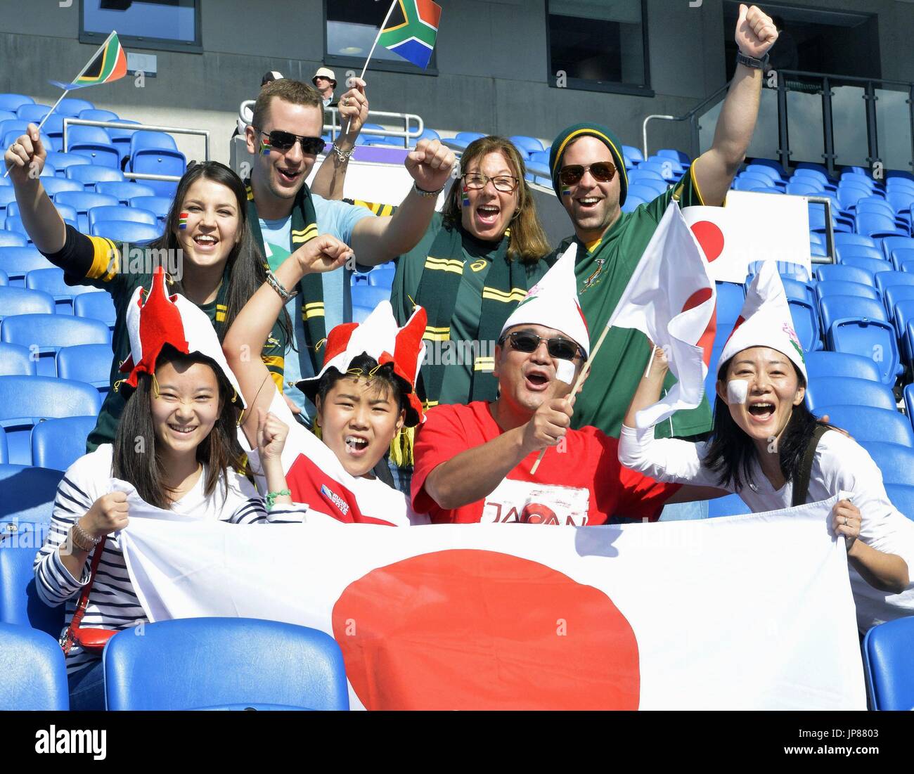 Rugby fans from Japan and South Africa pose for a photo ahead of a Pool ...