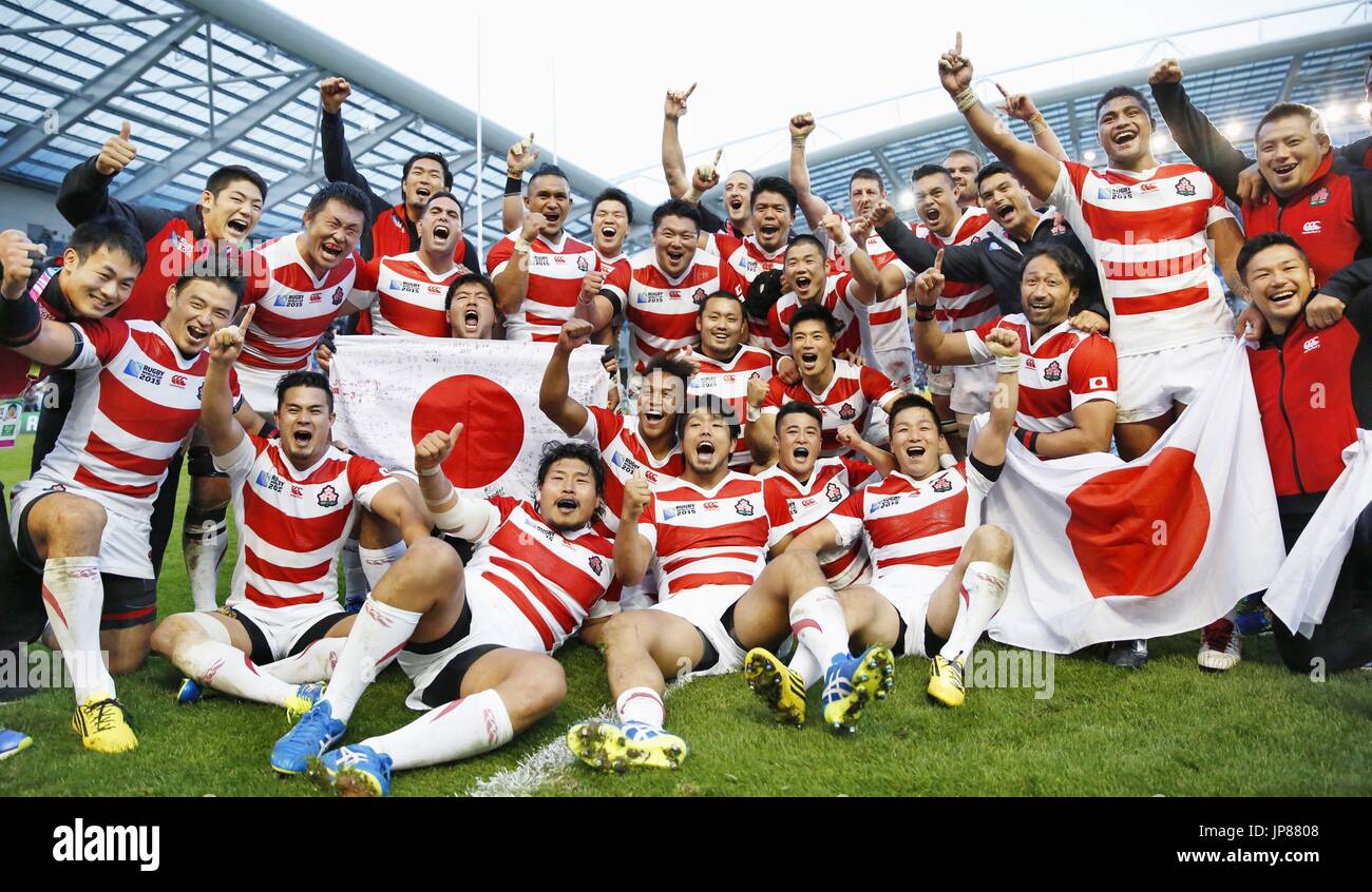 Japan players pose for a photo after beating South Africa 34-32 in a ...