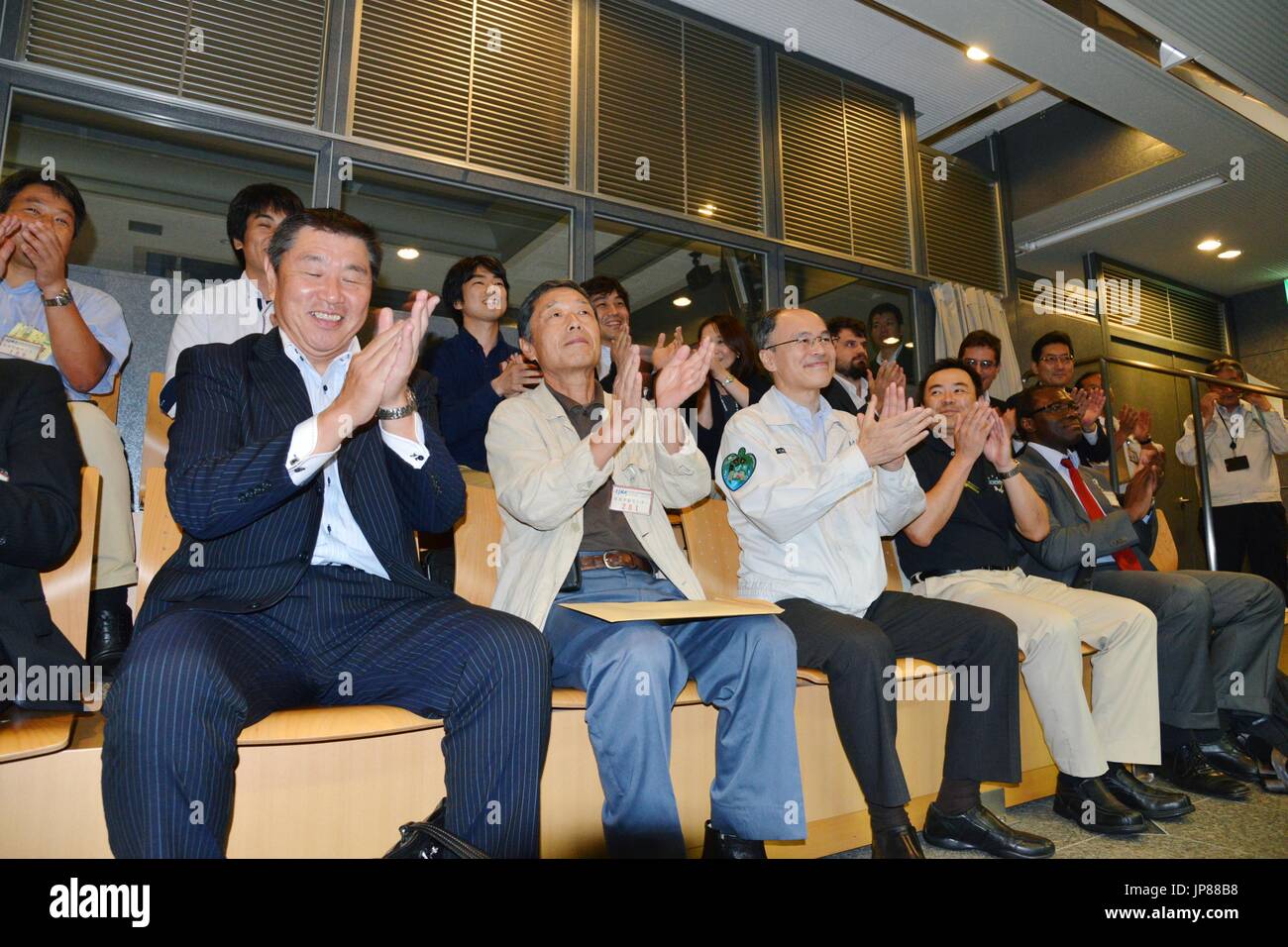 Officials of the Japan Aerospace Exploration Agency (JAXA), the Chiba ...