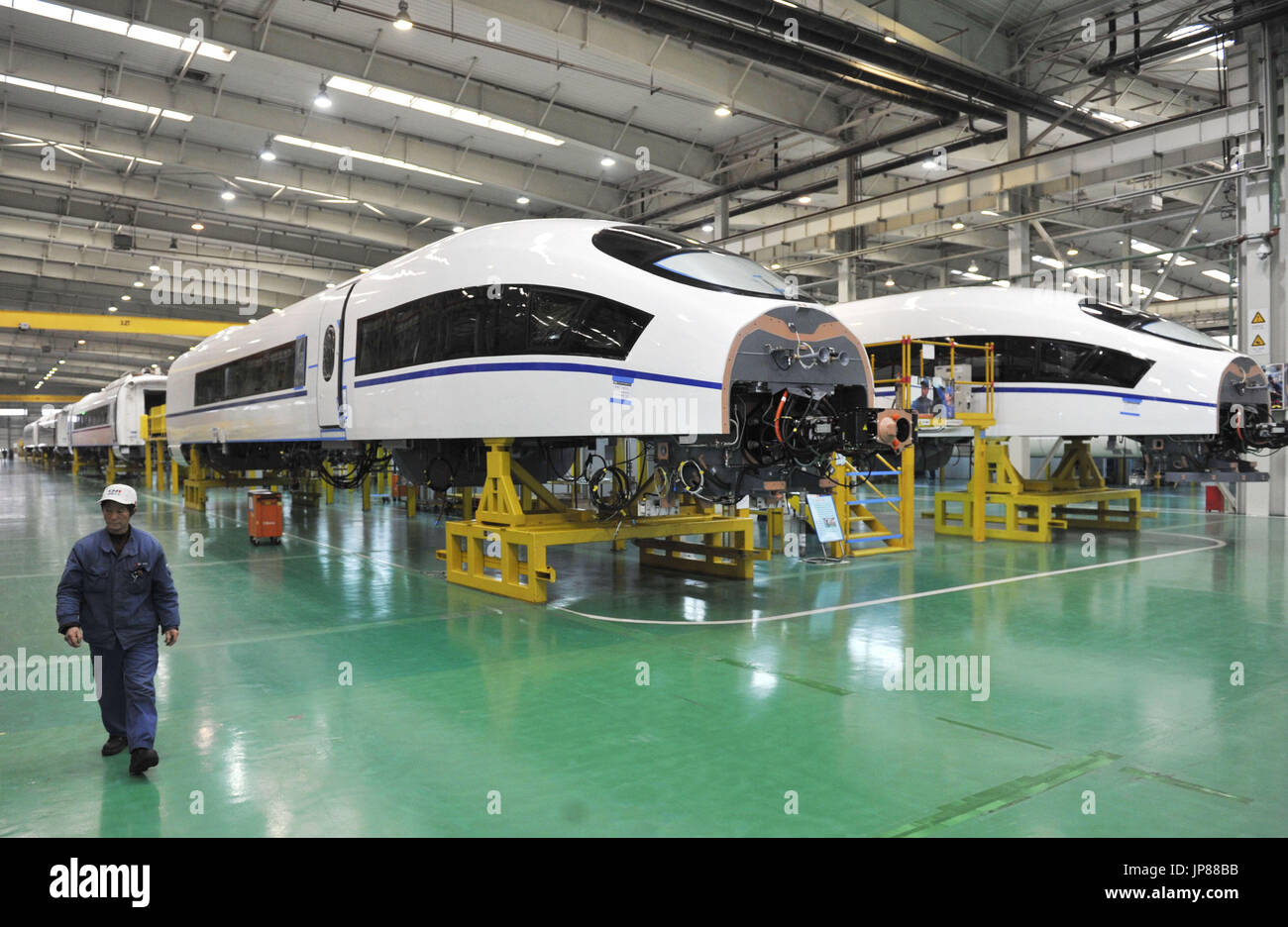 File photo taken in February 2015 shows a high-speed train factory in ...