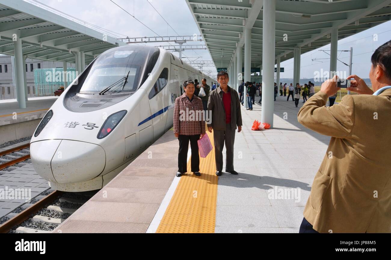 A high-speed train arrives at a brand-new station in Hunchun in the ...