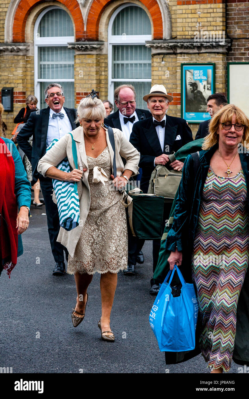 Opera fans arrive at Lewes railway station enroute to Glyndebourne ...