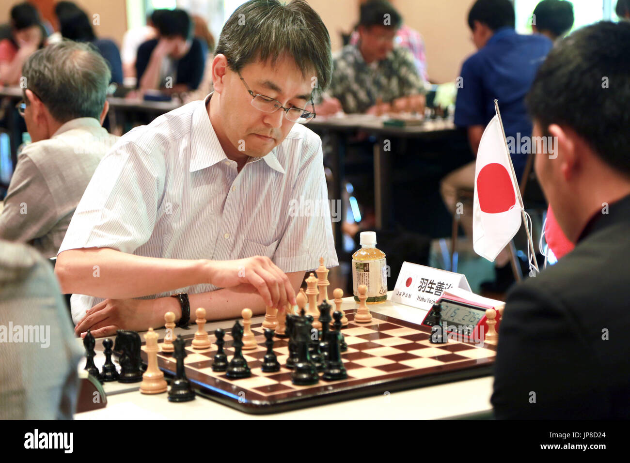 Professional Japanese shogi player Yoshiharu Habu (L), also the top ...