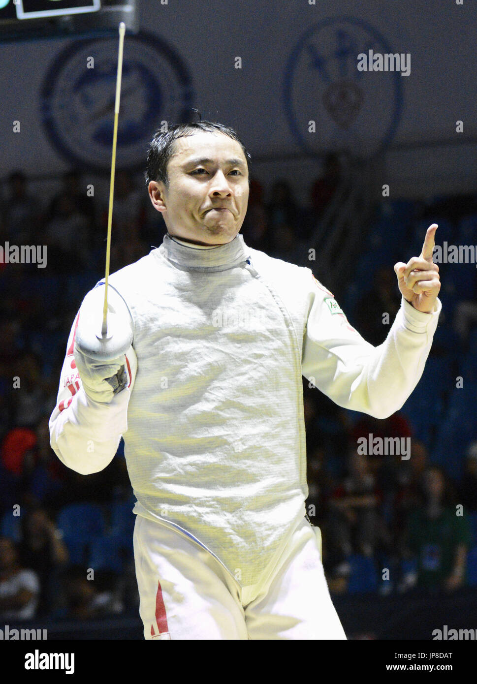 Yuki Ota of Japan celebrates after advancing to the semifinals of the ...