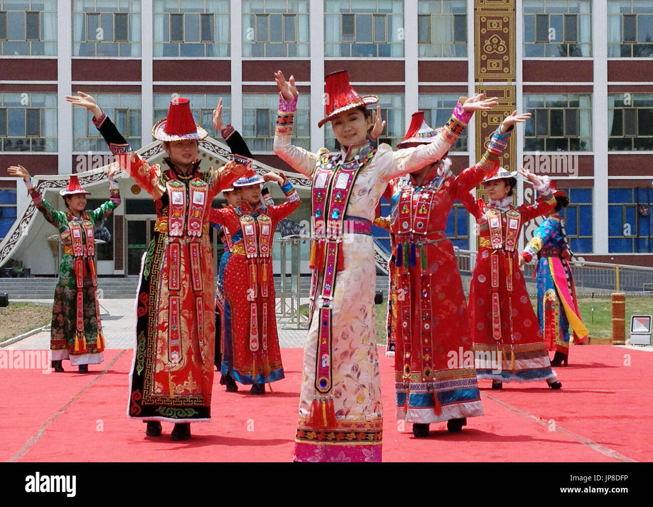 Women of China's Yugur ethnic minority donning colorful ethnic garbs ...